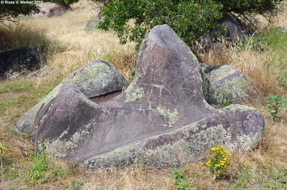 Well worn petroglyphs on an unusual water-smoothed boulder at Upper ...